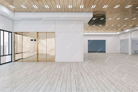 Простой просторный офисный интерьер с деревянными полами блестящими потолочными лифтами окнами
