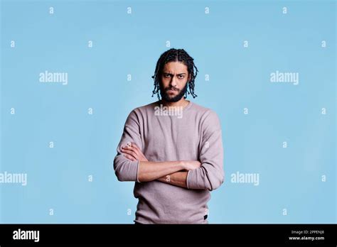 Arab Angry Man Frowning Eyebrows And Standing With Crossed Arms