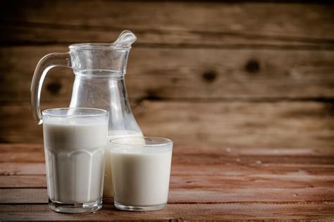 Premium Photo Milk In Jugs And Glasses
