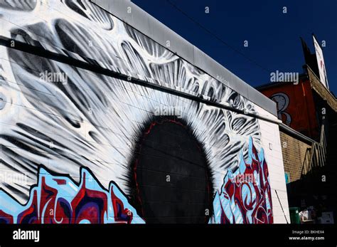 Graffiti Art Of An Iris And Pupil With Tag In Alley Matching A