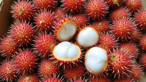 Fresh Ripe Rambutan Fruits With Red Hairy Shells Some Peeled To Show