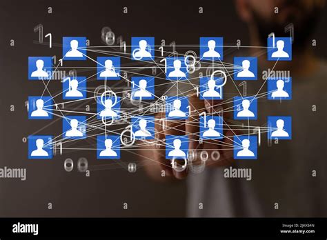 A Person Tapping On A Hovering Network With Blue People Icons Stock
