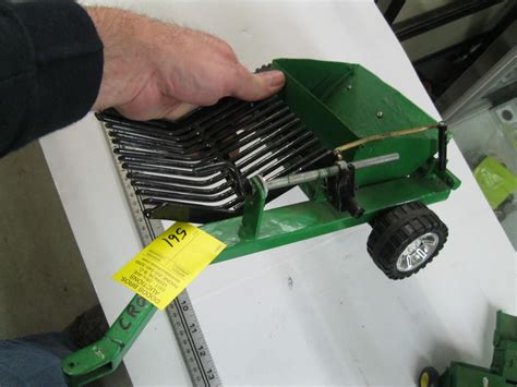 Tractor Wbailer And A Rock Picker