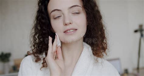 Young Brunette Woman Removing Makeup From Her Face With Cotton Pad Stock Video Video Of