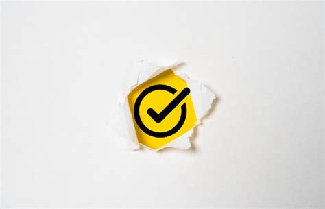 Premium Photo Correct Sign Symbol Inside Of White Paper Punched For