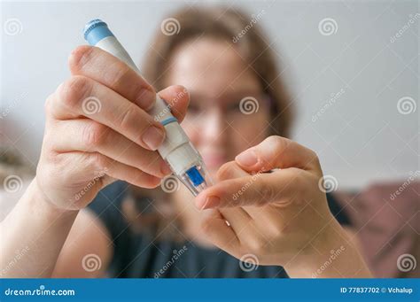 Glucometer With A Needle On A Blue Background Measurement Of Blood