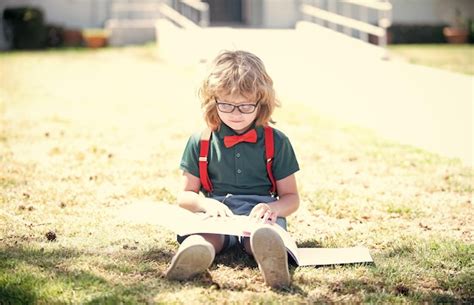 Premium Photo Smart Curious Nerd In Glasses Reading Book Study With