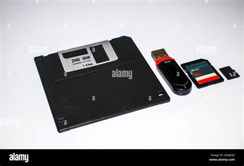 Old Floppy Disk Usb Flash Memory Card And Micro Memory Card On White Background Indoors Stock