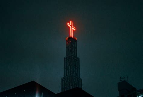 Lighted Cross On Top Of Building During Night Time Photo Free Night