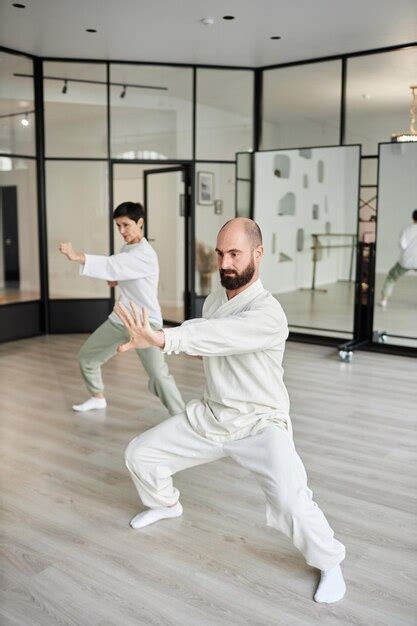 Premium Photo Qigong Master And Student Practicing Pose