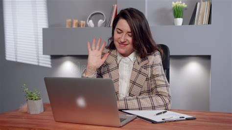 A Female Virtual Assistant Psychotherapist Waving Hand To Say Goodbye
