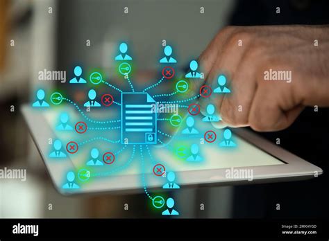 access to documents man using tablet closeup scheme over device