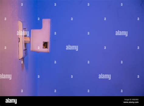 Wifi Repeater In Electrical Socket On The Wall Device That Help To Extend Wireless Network In