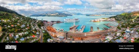 Scenic Panorama Of Diamond Harbour In Lyttleton Port Town Of New Zealand With Busy Cargo