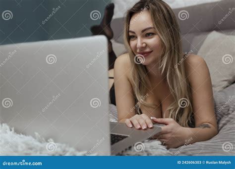 Woman In Black Lingerie Lies On The Bed And Uses A Laptop Sex Model Stock Image Image Of Date