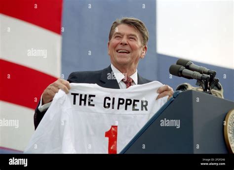 President Ronald Reagan Holding The Gipper Jersey At A Campaign