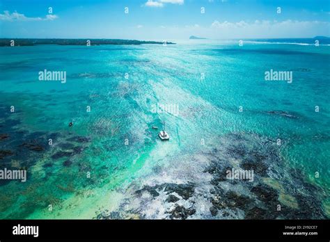 Great Aerial View Of A Modern Catamaran Anchored Off The Island Of Lîlot Bernache Mauritius