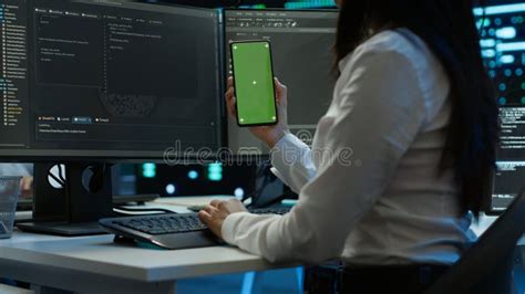 Worker Overseeing Data Center Using Green Screen Mobile Phone Stock