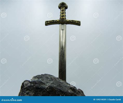 Excalibur The Mythical Sword In The Stone Of King Arthur Stock Image