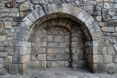 Premium Photo Stone Arch Entrance Wall With Ivy In The Garden