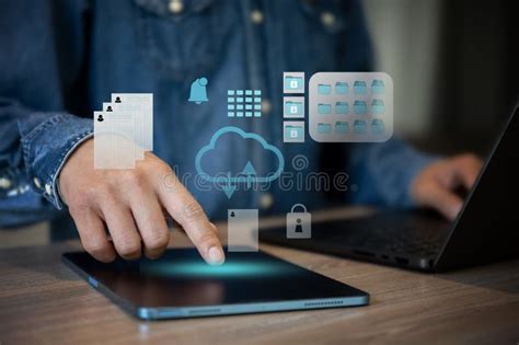 Business Man Work With Laptop Seek Data Input And Output From Cloud Data Icon Floating On Screen