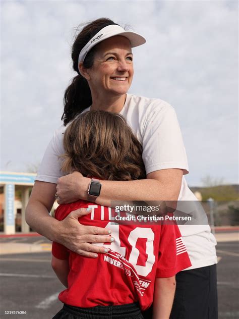 Amy Edinger Hugs Her Son Miles After He Participated In The 16th