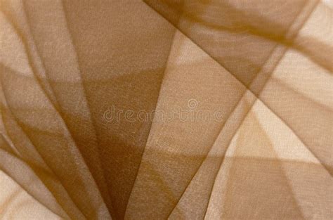 Backlit Translucent Fabric With Lines And Triangles Is Layered To Form Geometric Simple Shapes In