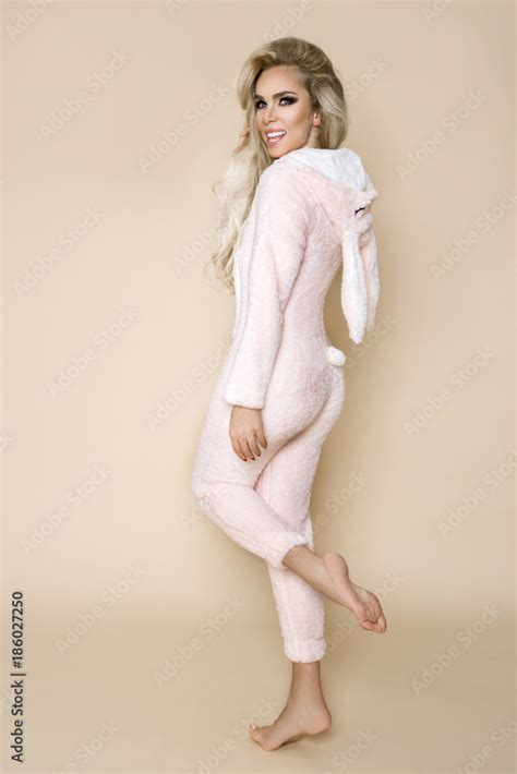 Beautiful Sexy Blonde Woman Wearing A Pajama A Bunny Costume Smiling