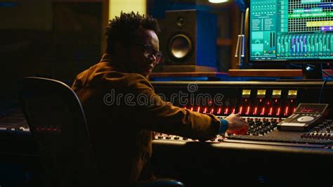 Portrait Of African American Sound Designer Mixing And Mastering Tracks Stock Image Image Of