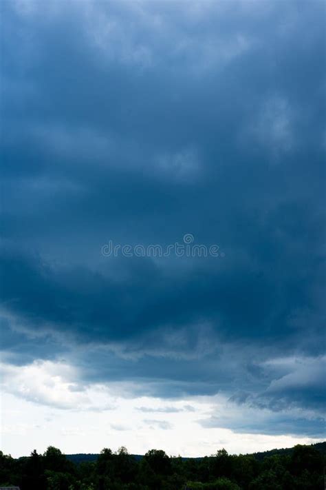 Dramatic Cloudscape A Captivating View Of Dark Storm Clouds Gathering