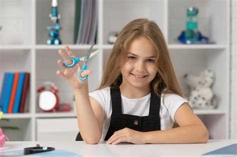 Premium Photo Happy Girl Hold Scissors In School Classroom