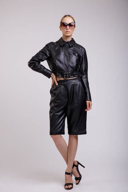 Premium Photo Woman In Black Leather Suit Bermuda Shorts Jacket Sunglasses White Background