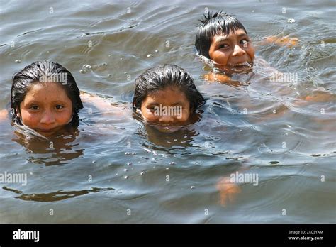 Suriname Tepu Girls Of The Trio Tribe Are Playing In The River Stock