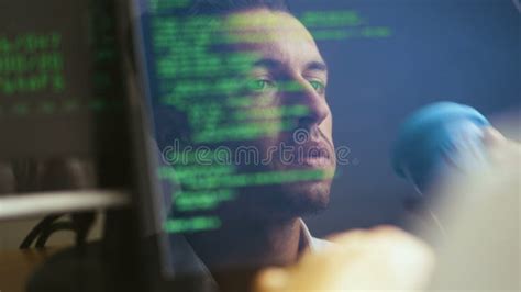 Double Exposure Shot Of Man Hacker Programmer Working At A Laptop Reflection In Monitor