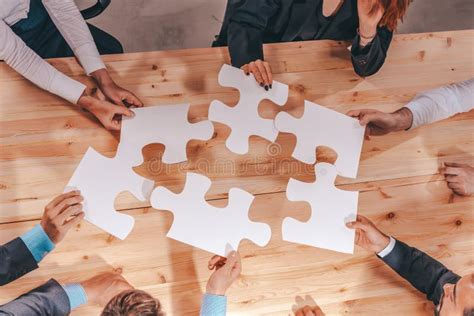 Teamwork Of Partners Connect Puzzle Pieces As Integration And Startup