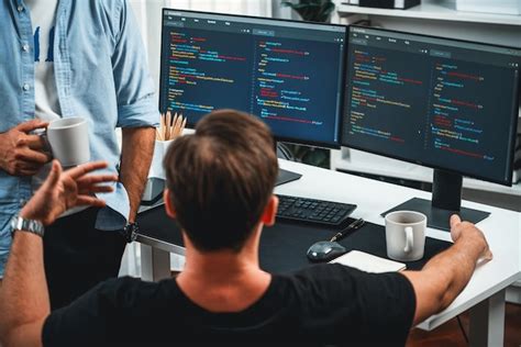 It Developers Discussing Online Software Development Information Sellable Premium Ai Generated