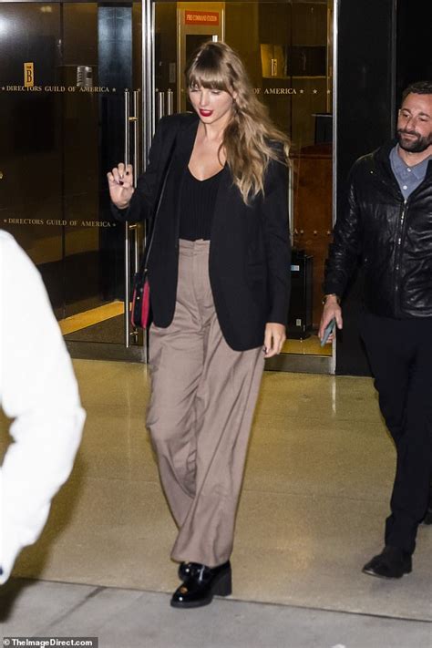 Taylor Swift Cuts A Chic Figure In Taupe Trousers And Black Blazer In