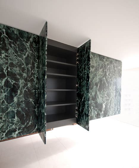 Monolithic Marble Partition Divides Antwerp Penthouse