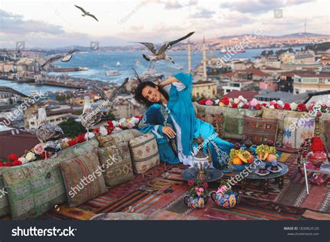 Beautiful Girl Sitting On A Roof Of Istanbul Over 27 Royalty Free