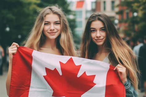 Premium Ai Image Two Girls Holding A Canadian Flag