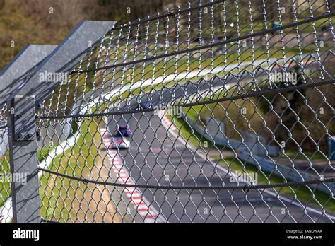 View Through A Safety Fence At The Nürburgring Race Track Blurred