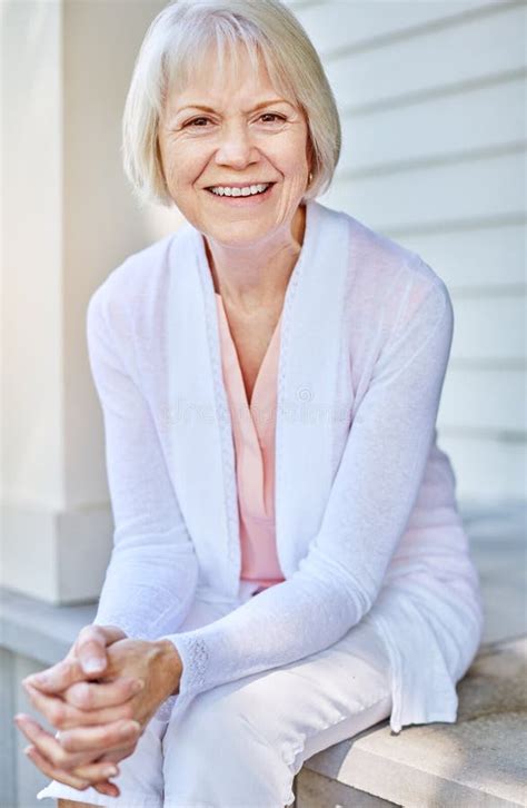 Life Is Good Cropped Portrait Of A Senior Woman Sitting On Her Porch