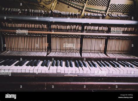 Old Broken Disused Piano With Damaged Keys Vintage Retro Filter Stock Photo Alamy