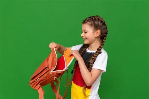 Premium Photo A Schoolgirl With German Language Textbooks