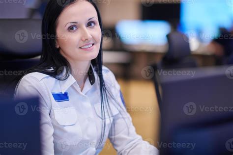 Female Operator Working In A Security Data System Control Room 10827991