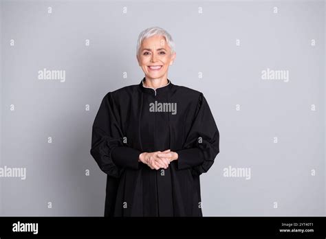 Photo Of Confident Judge Senior Woman In Black Robe Smiling Verdict Isolated Grey Color