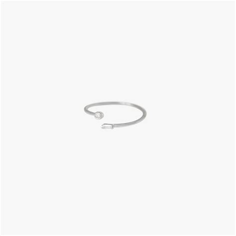 The Tiny Baguette Diamond Ring In Solid Gold Flecked With Gold