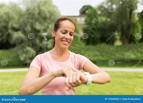 Woman With Smart Watch Or Fitness Tracker In Park Stock Image Image