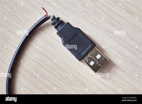 Broken Usb Cable On A Wooden Table Stock Photo Alamy