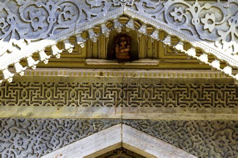 Ornate Architectural Detail Features Intricately Carved Geometric And Floral Patterns In Stone